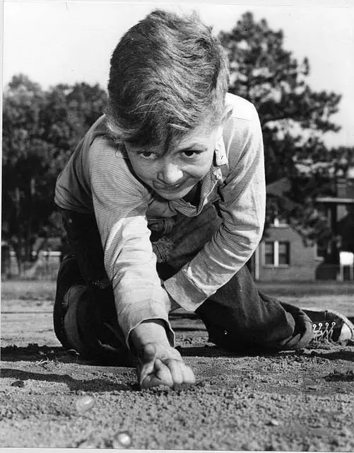 The boy plays in Marble, 1961. 26. Games that have forced children to be mobile, learn